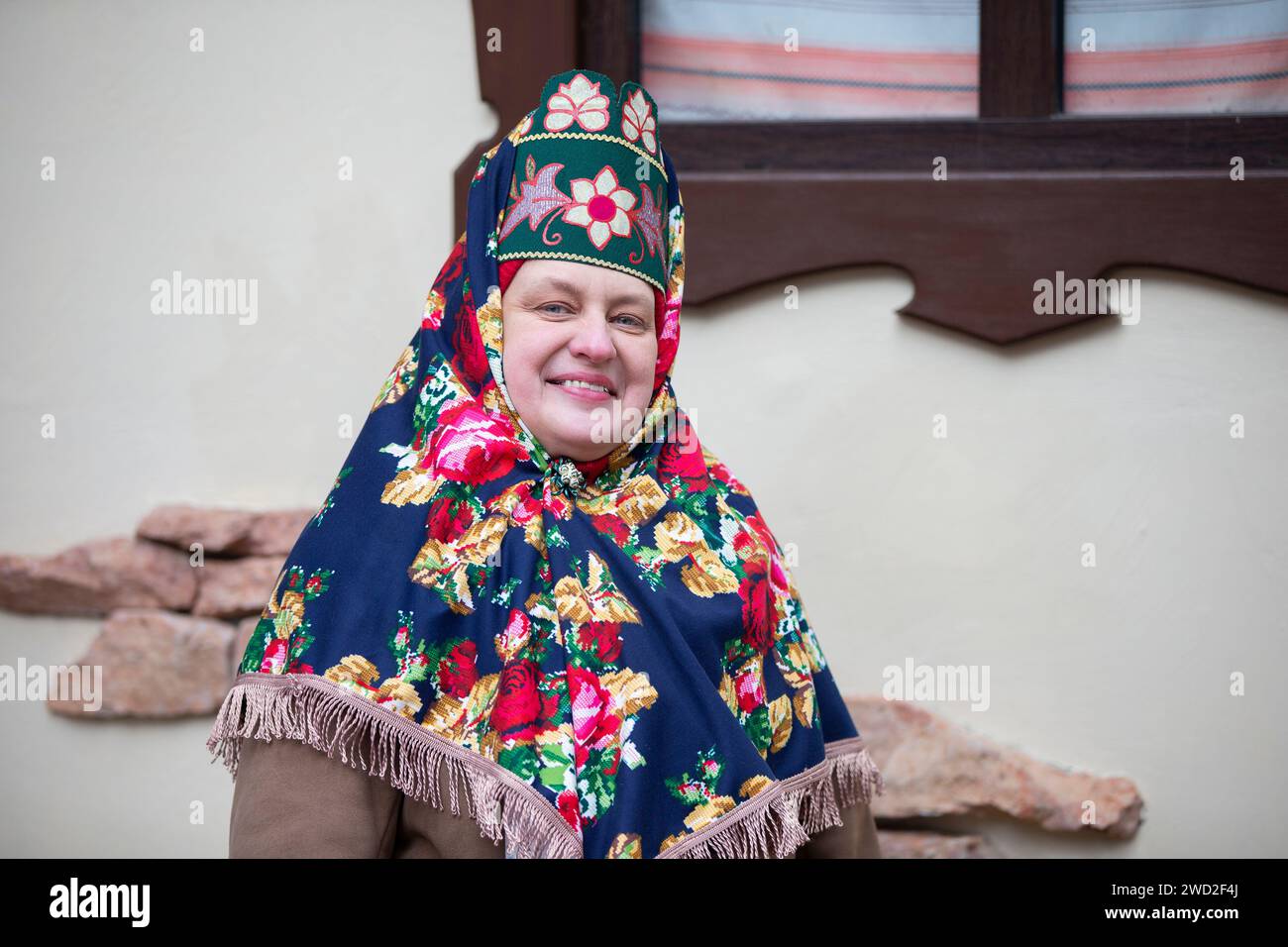 An elderly Russian woman in a traditional headdress, kokoshnik, poses ...