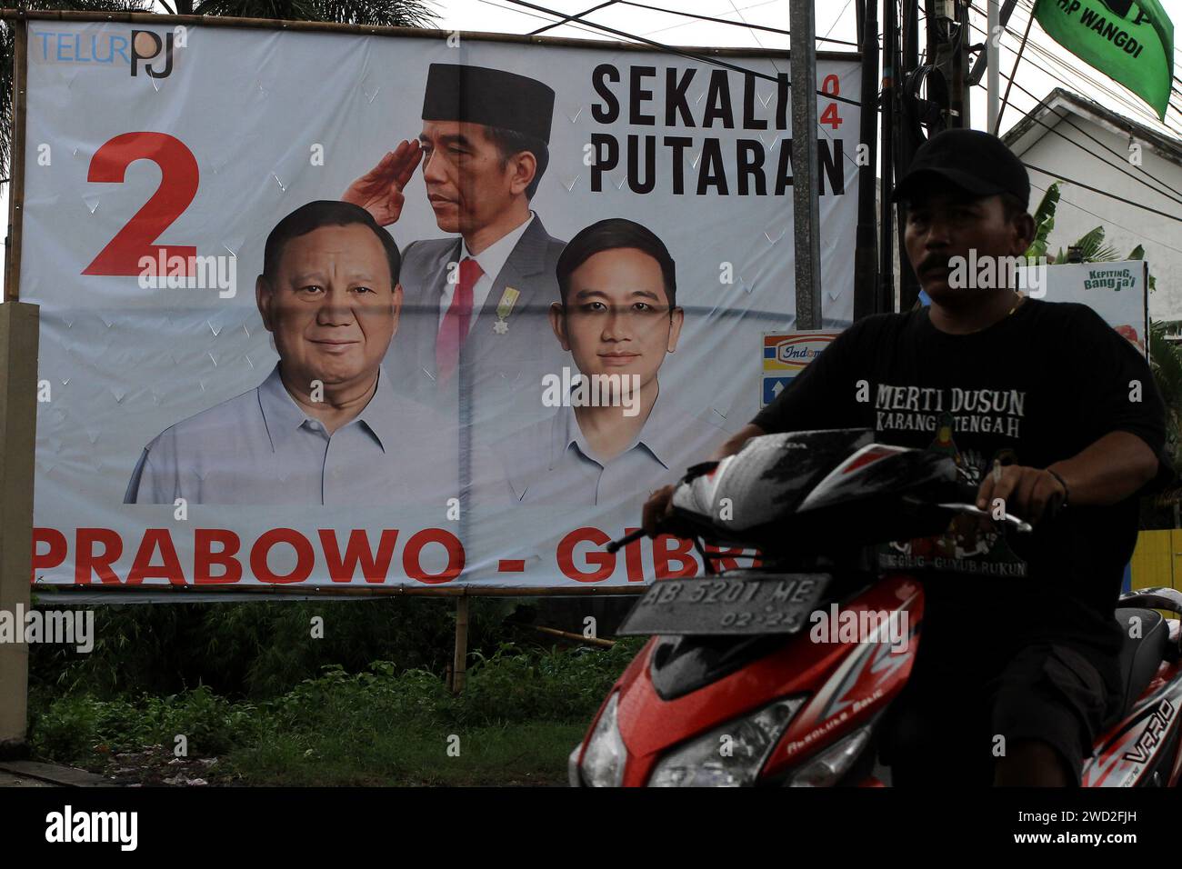 Sleman, Yogyakarta, Indonesia. 18th Jan, 2024. A motorcyclist passes ...