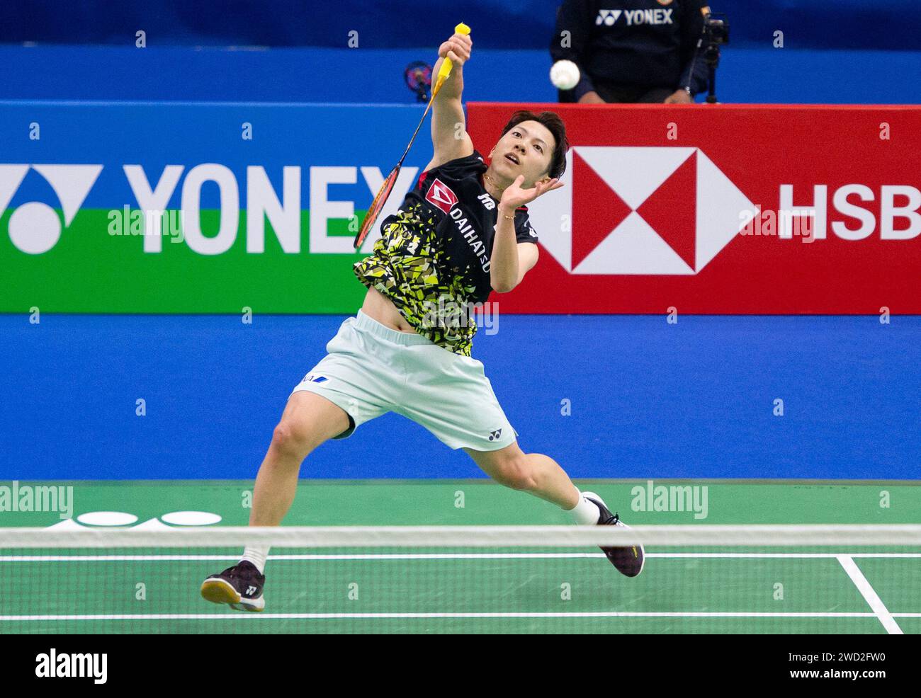 New Delhi, India. 18th Jan, 2024. Watanabe Koki of Japan returns a shot during the men's singles ...