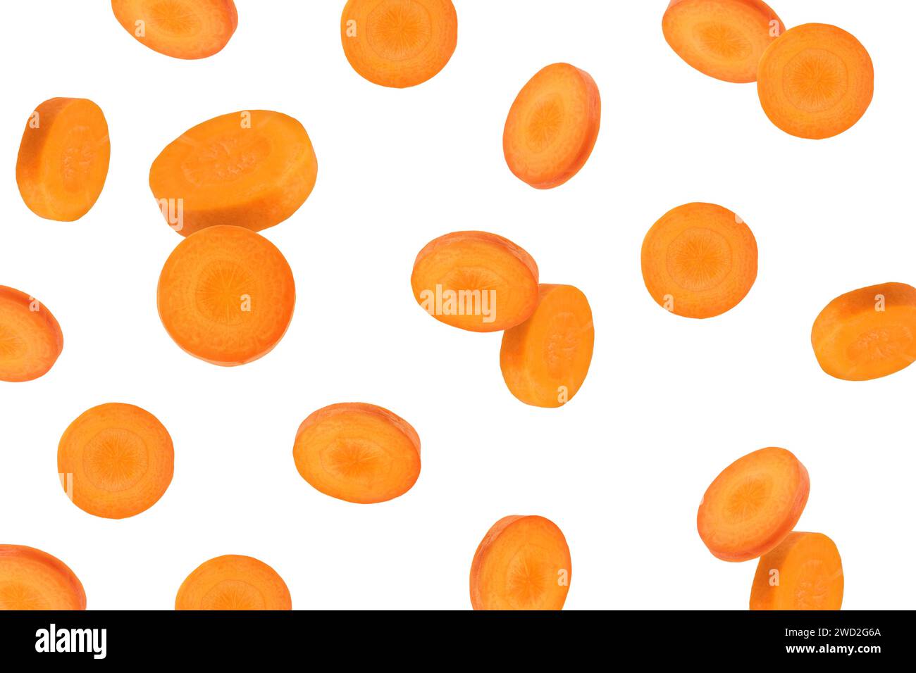 Fresh carrot slices falling on white background Stock Photo - Alamy