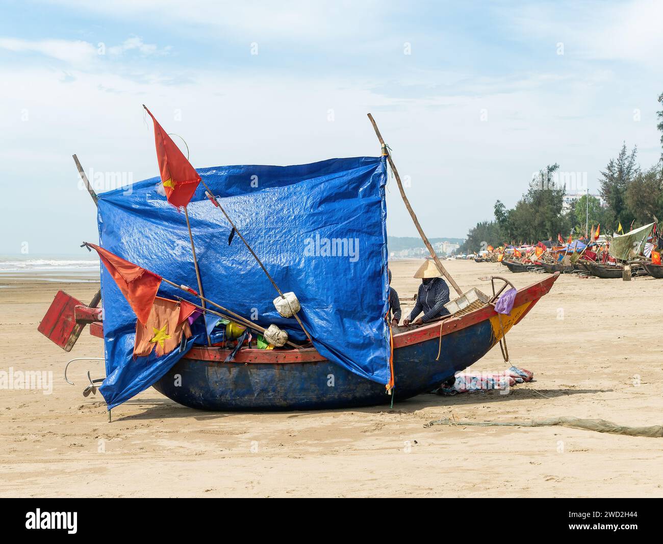Fishing boat at Sam Son Beach, Thanh Hoa, Vietnam on the beach, with ...