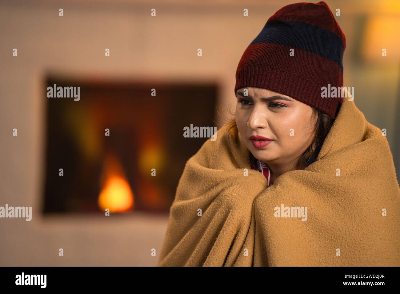 close up shot of indian women shivering from freezing cold or fever at ...