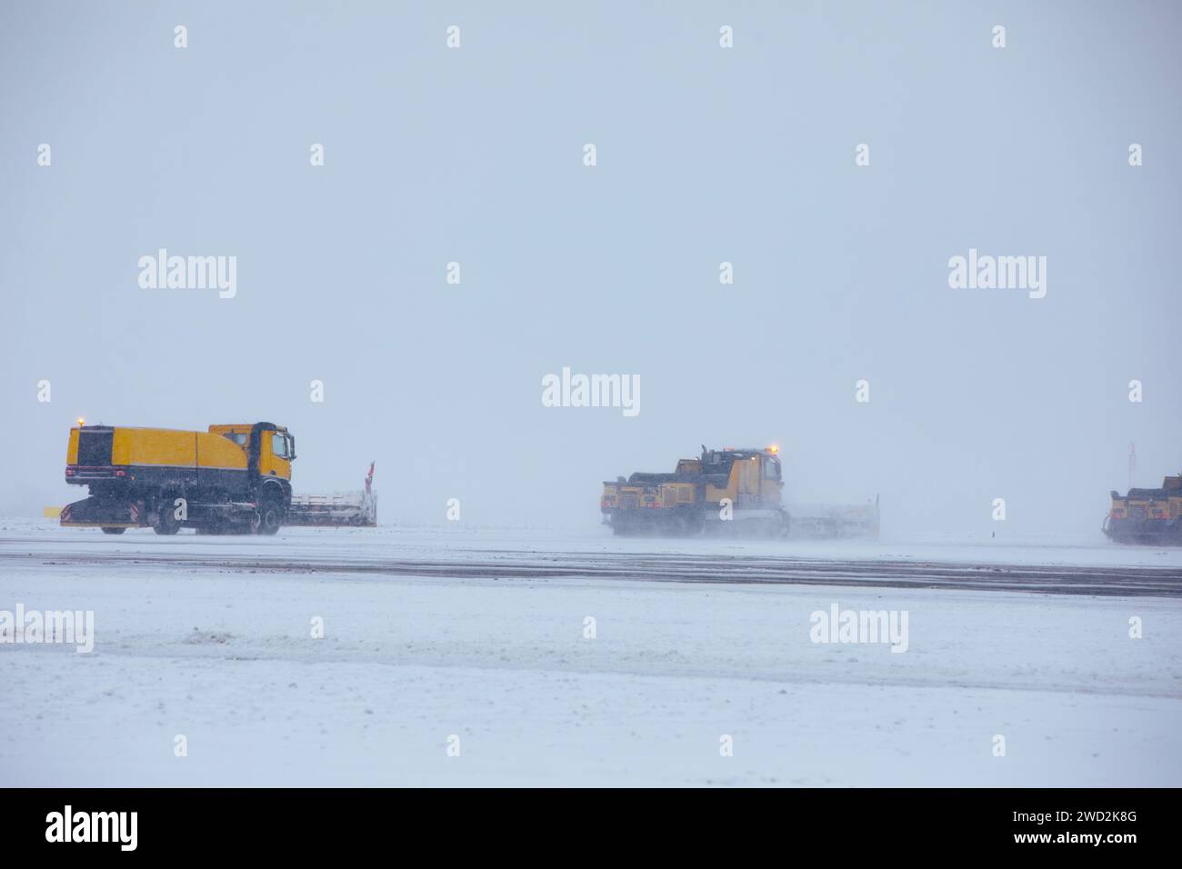 Airport in winter with snow plough hi-res stock photography and images ...