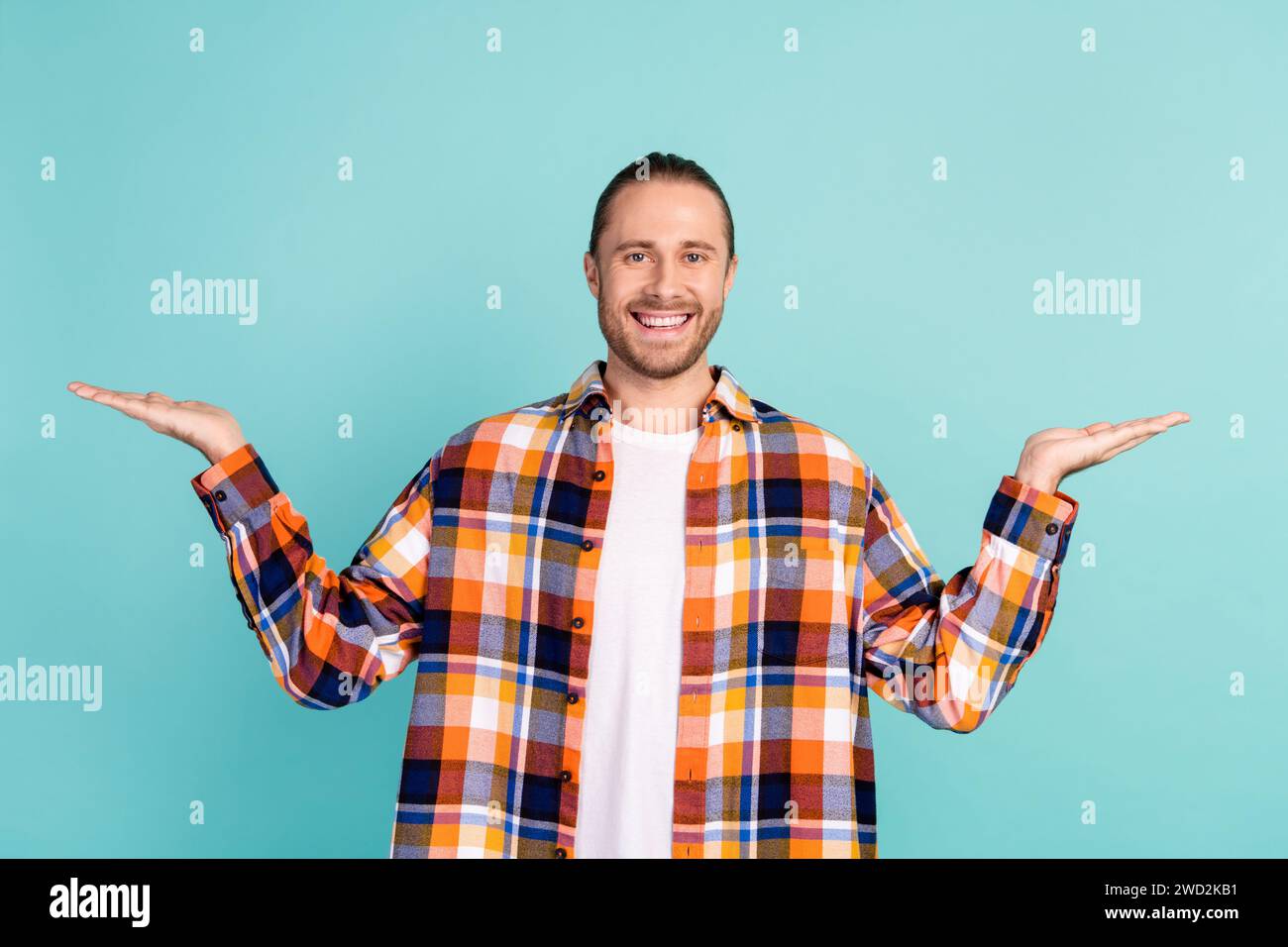 Portrait of cheerful positive guy wear flannel shirt two palms ...
