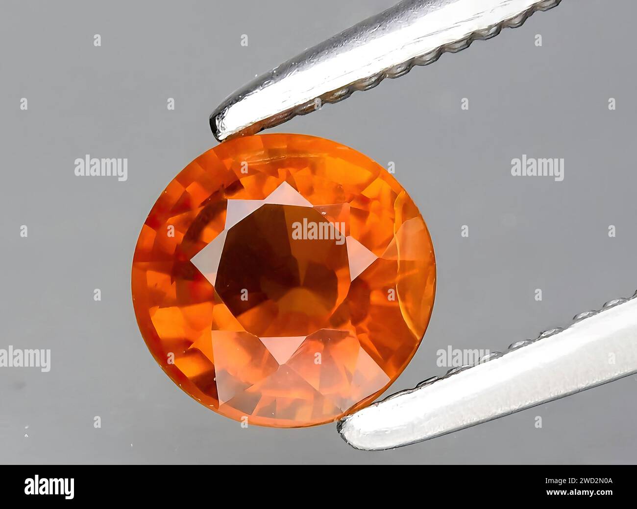 natural orange tourmaline gem on background Stock Photo - Alamy