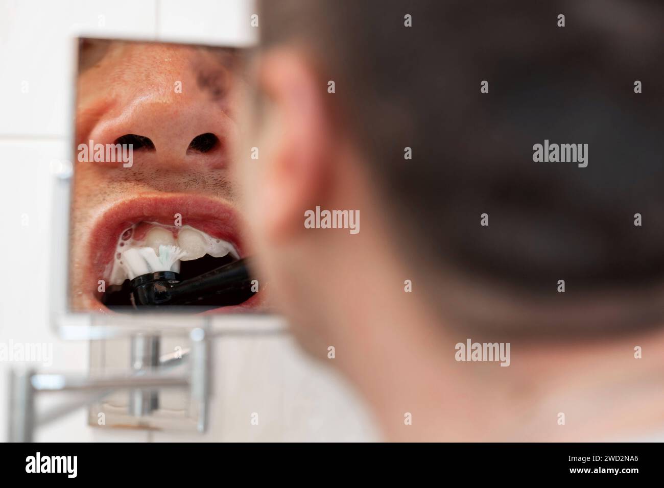 Bavaria, Germany - January 6, 2024: Close-up of a man brushing his ...