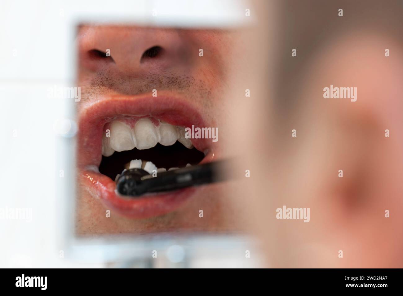 Bavaria, Germany - January 6, 2024: Close-up of a man brushing his ...