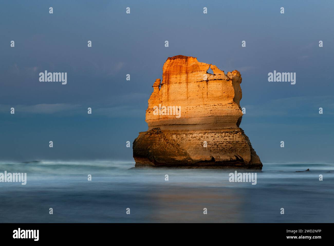 A long exposure on a huge sea stack of the famous Twelve Apostles Stock ...