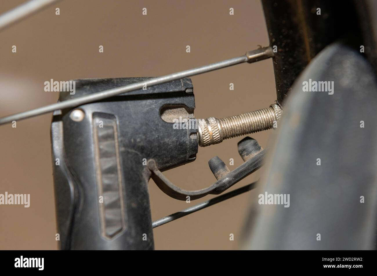General stock Bicycle repairs. Repairing a puncture. Pump on a schrader ...