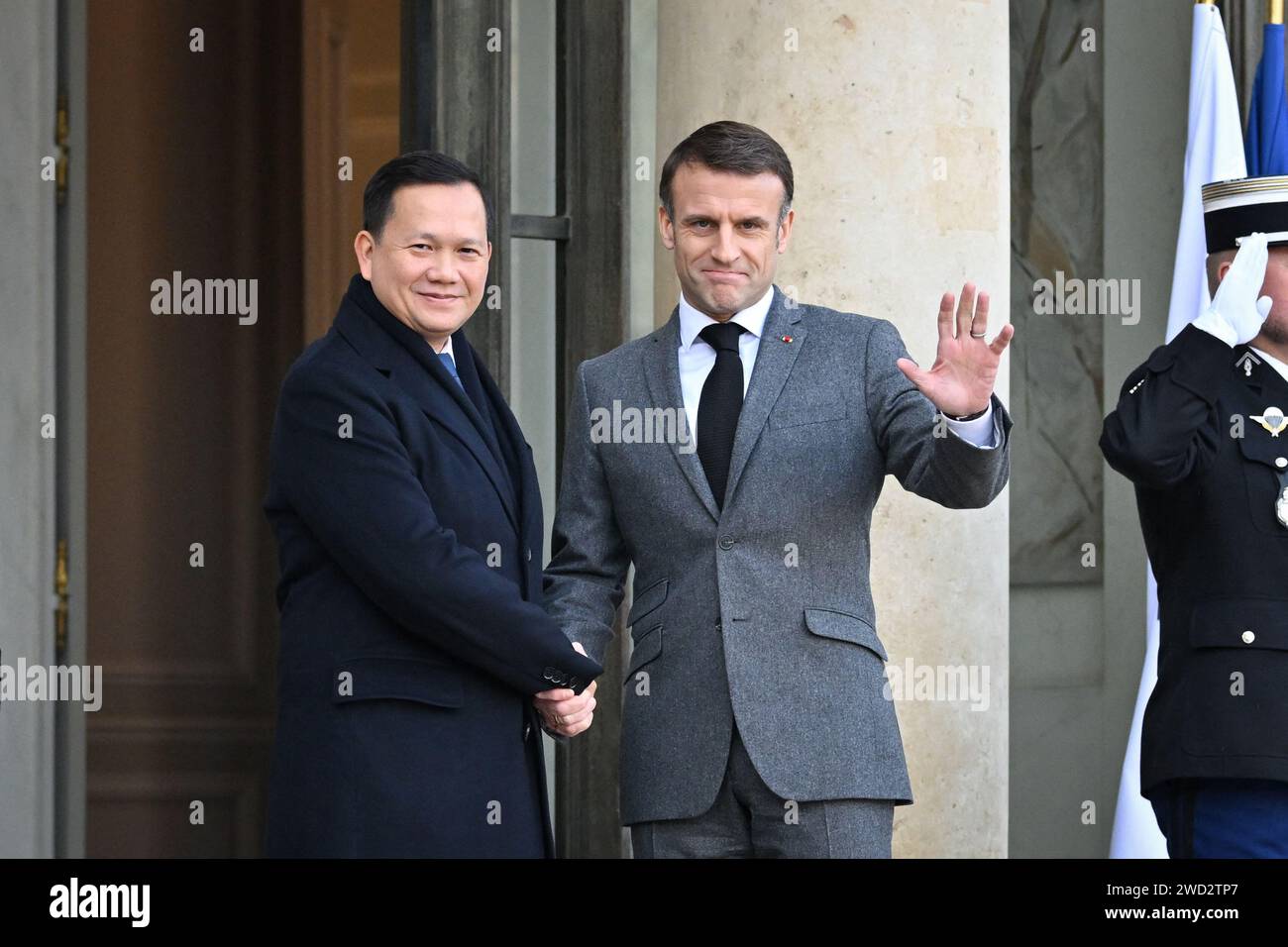 Paris, France. 18th Jan, 2024. French President Emmanuel Macron greets ...