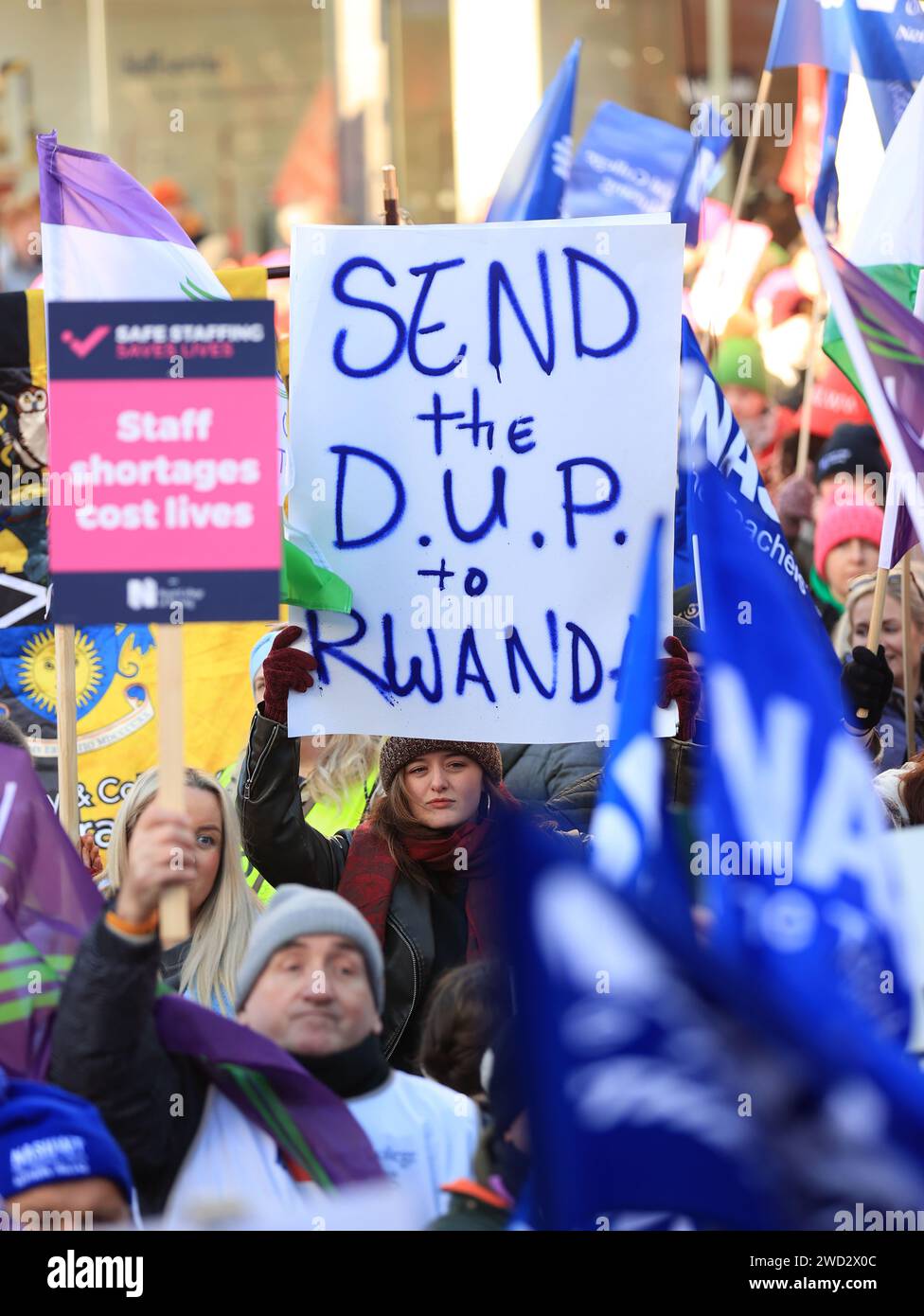 People during a rally by unions outside Belfast City Hall, Belfast, as ...