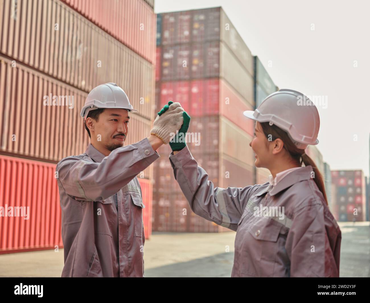 Engineer man and woman with high five , Celebration Success Happiness ...