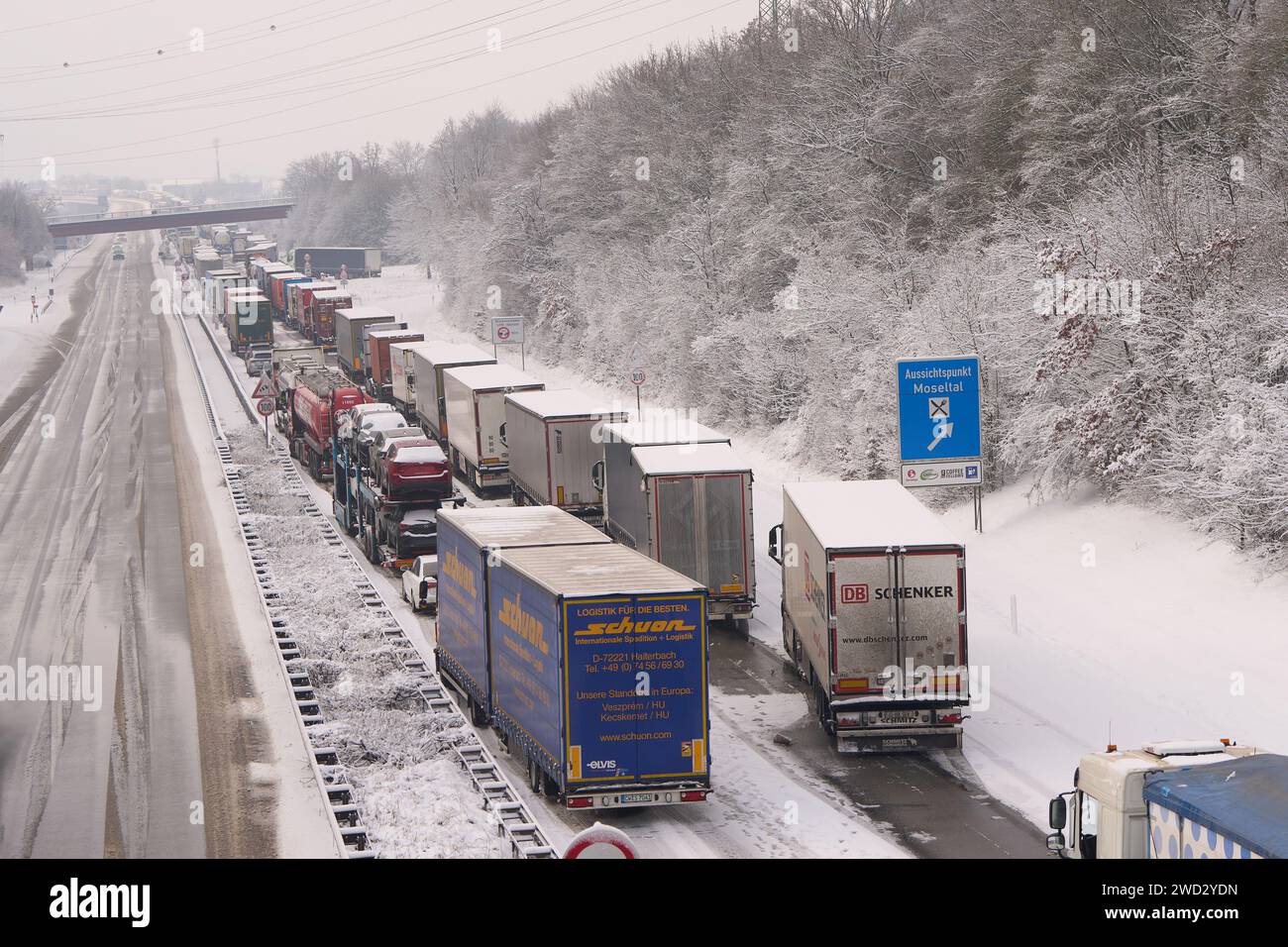 Winningemn, Germany. 18th Jan, 2024. Trucks are jammed on the A61 ...
