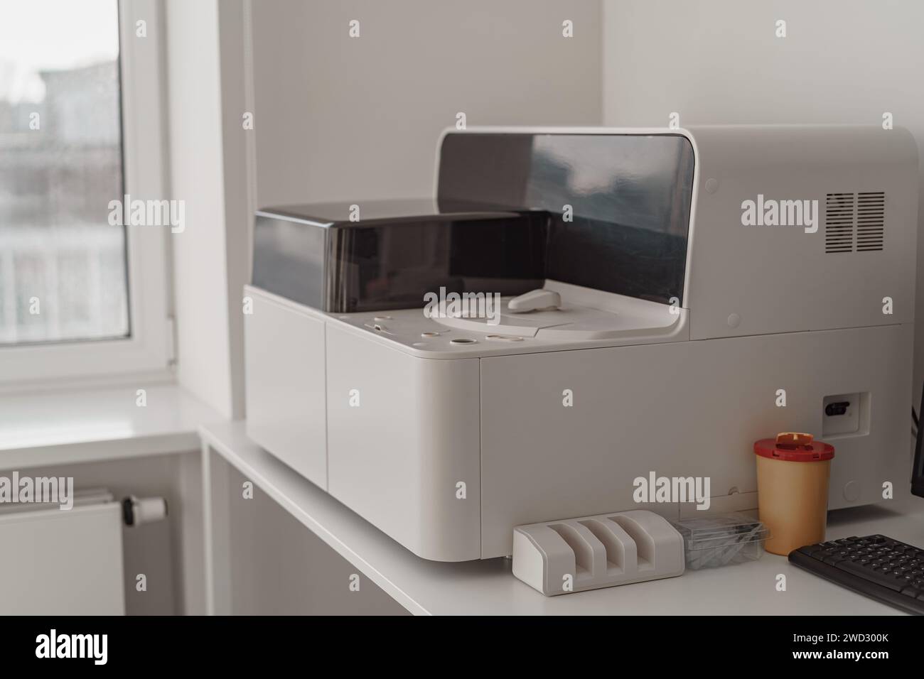 Microcentrifuge machine with test tubes standing in research laboratory ...