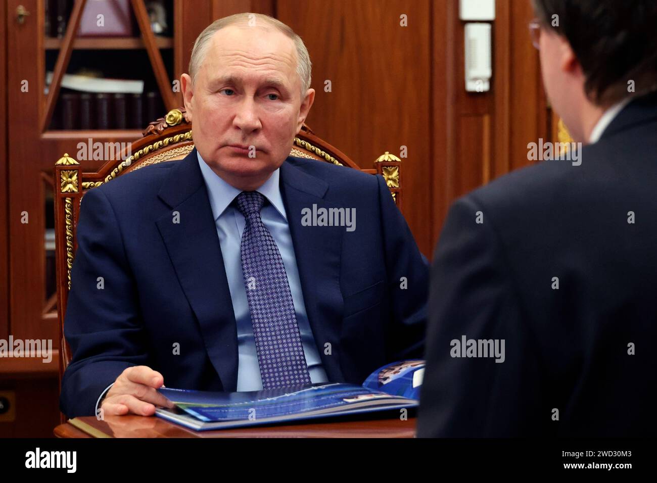 Russian President Vladimir Putin listens to Ruslan Baysarov, Chairman ...