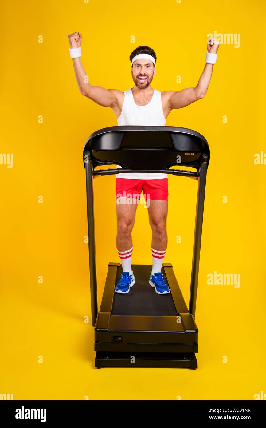 Full length photo of strong cool guy activewear walking treadmill ...