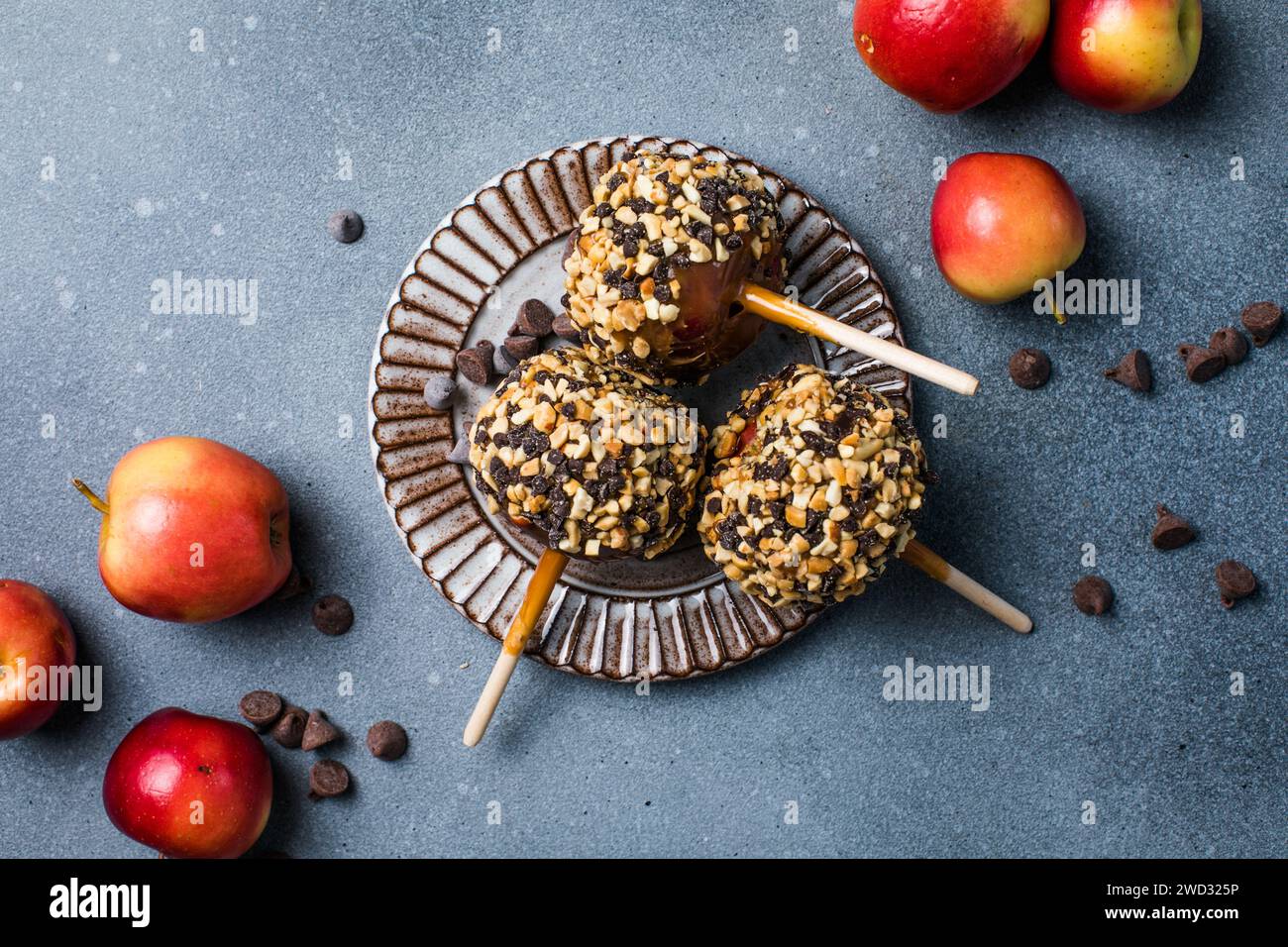 delicious carmel candy apples with covered in chopped nuts Stock Photo ...