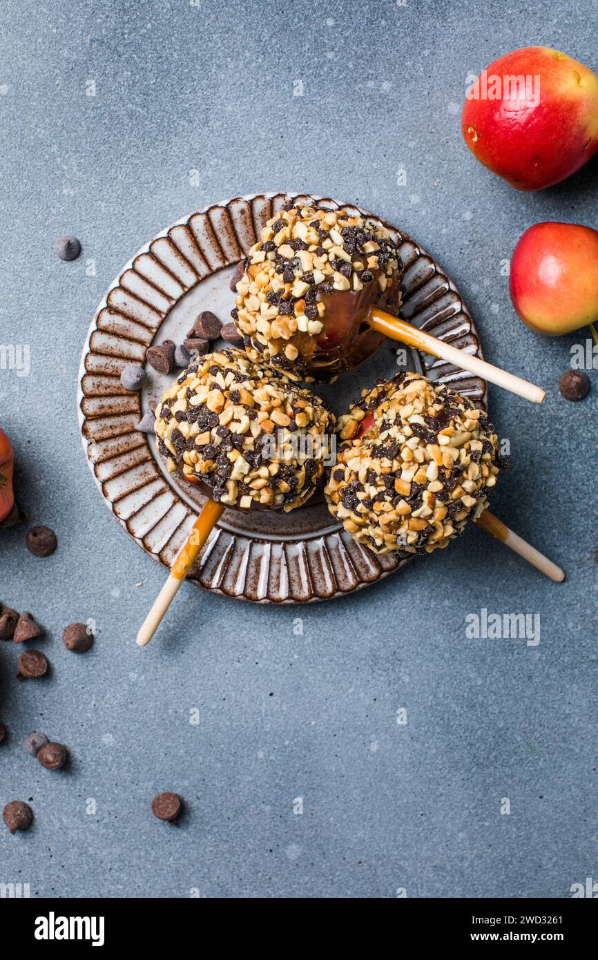 delicious carmel candy apples with covered in chopped nuts Stock Photo ...