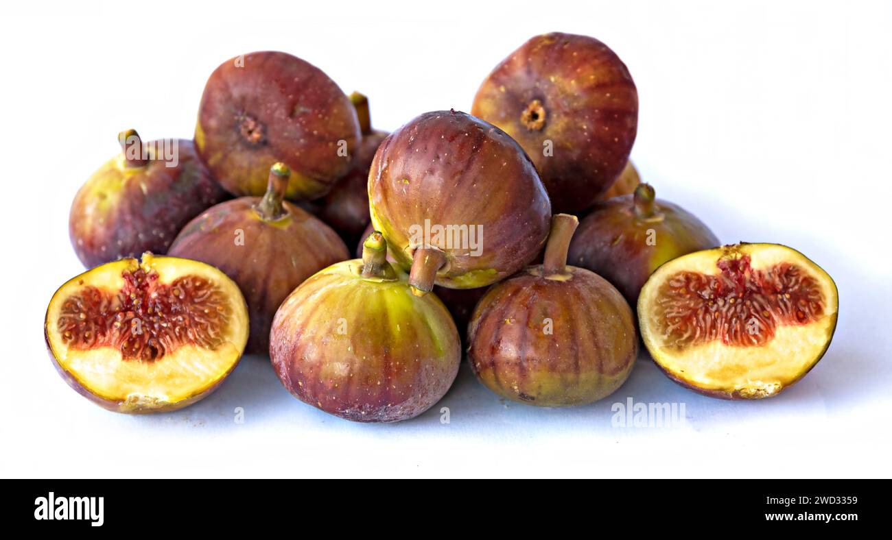Fig and section isolated on white background Stock Photo - Alamy