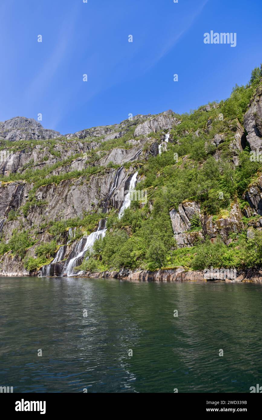 Fresh waterfalls cut through the lush, moss-covered cliffs of ...