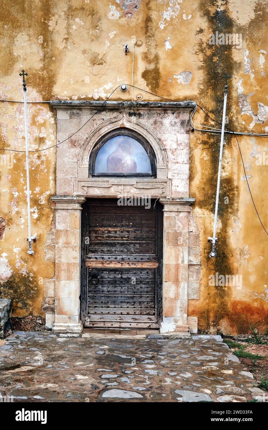 destroyed wooden door to an Orthodox chapel on the Greek island of ...