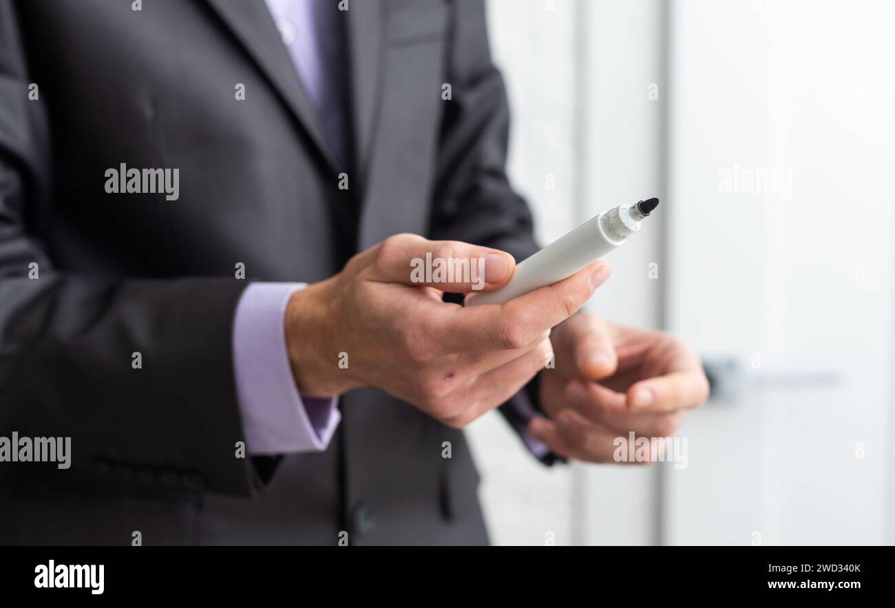Man writes something on screen. Businessman raised his hand to screen ...