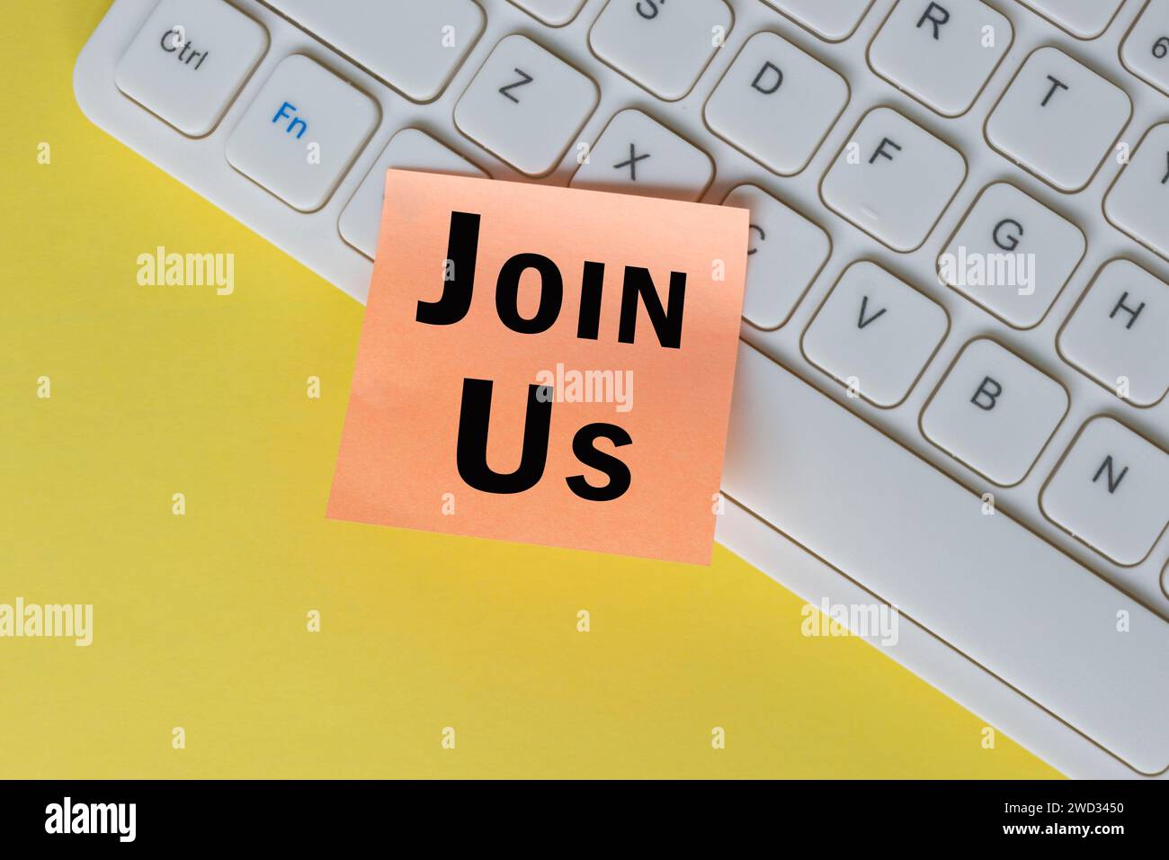 Join us text on orange sticky note on top of white keyboard Stock Photo ...