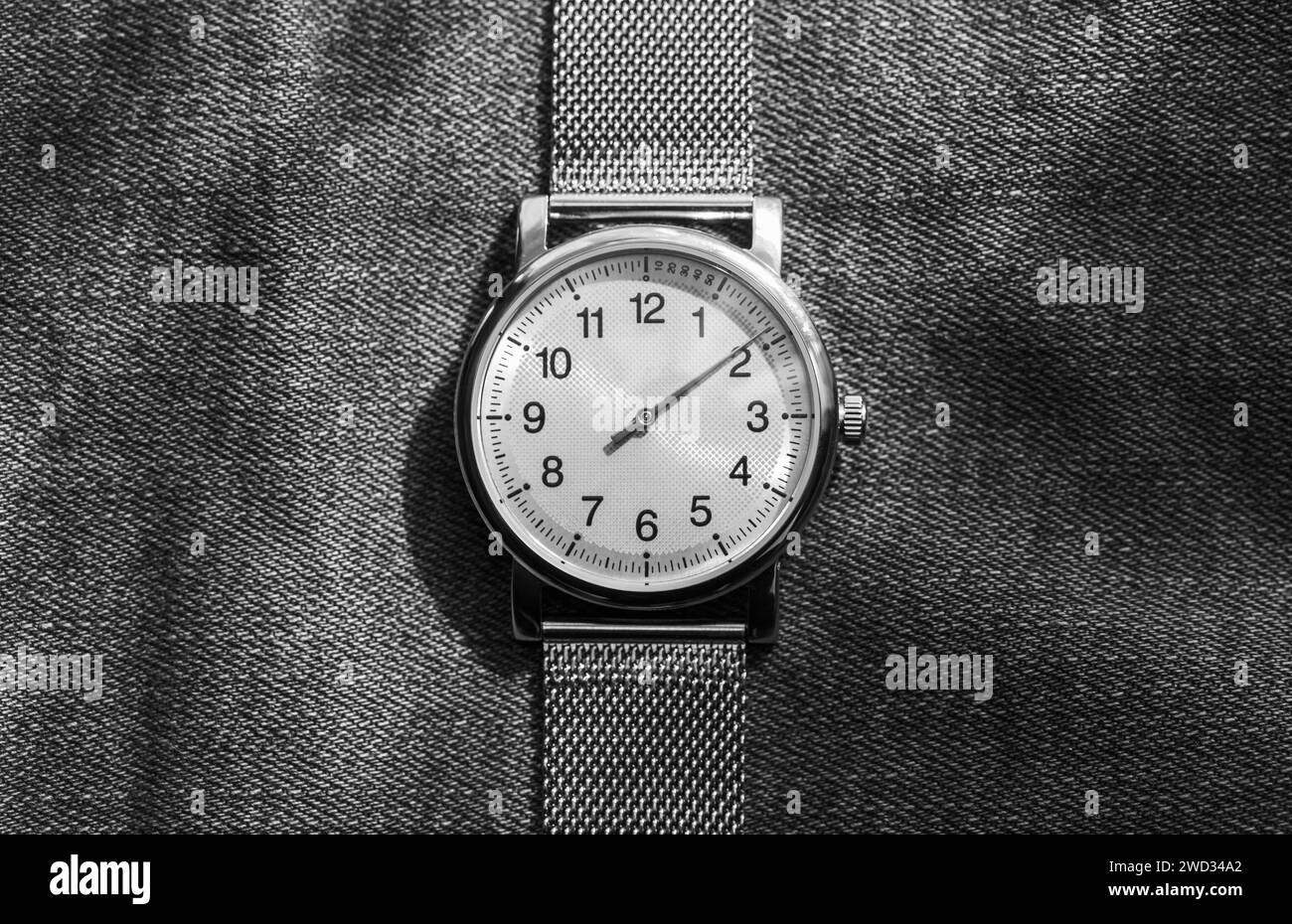 Single hand watch in stainless steel case. Closeup photo, top view ...
