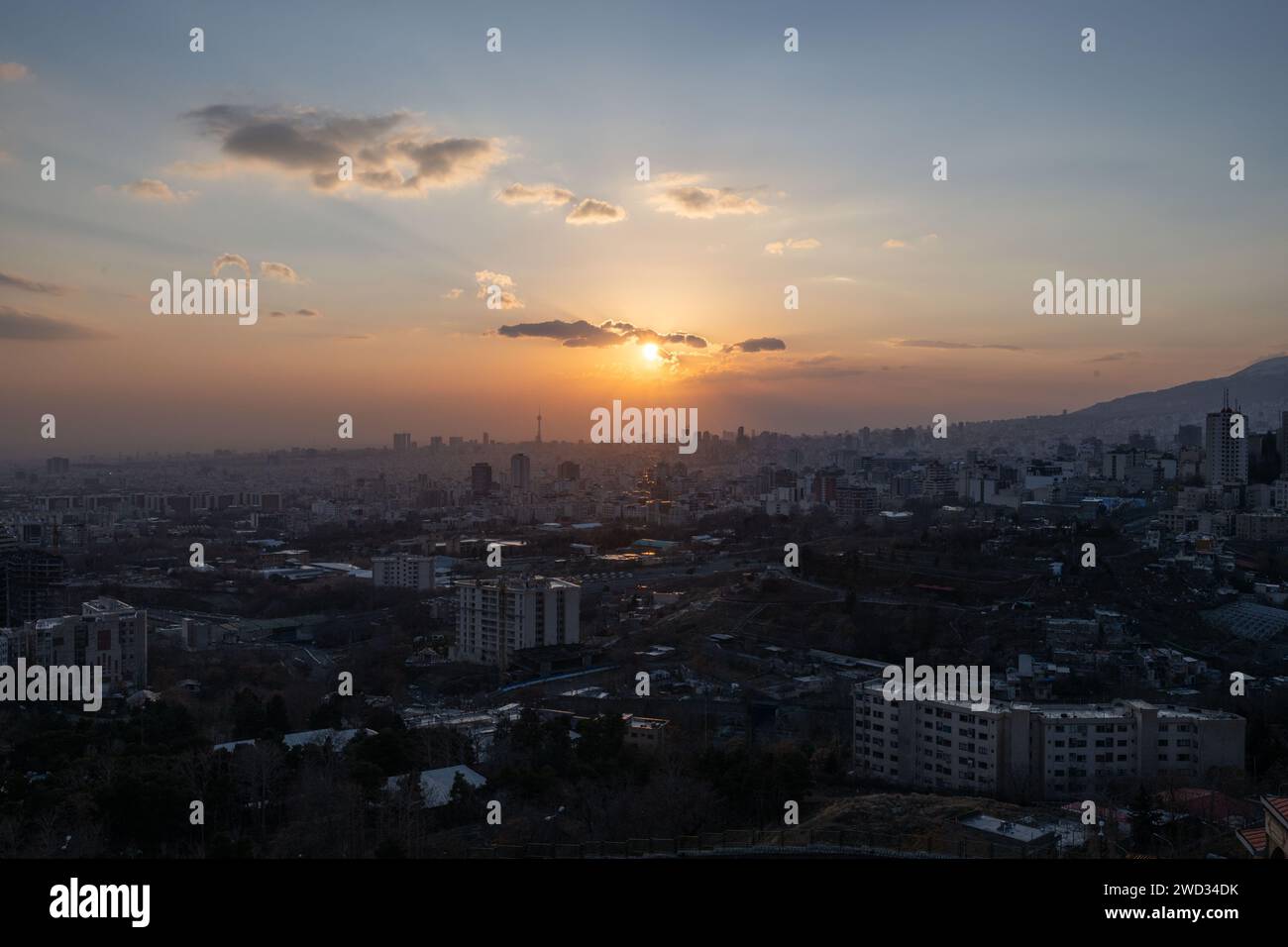15 January 2024, Iran, Teheran: Rays of sunlight break through a few ...