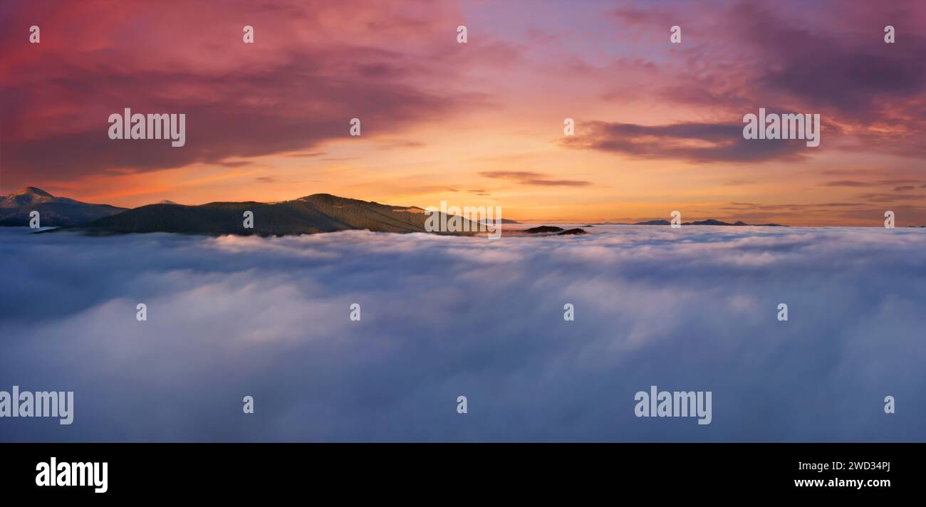 Beautiful sunrise high in the mountains above the clouds. Dramatic ...