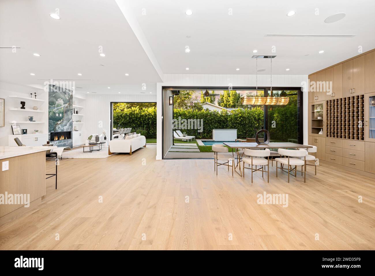 Spacious living room with stylish furniture and a modern glass wall ...
