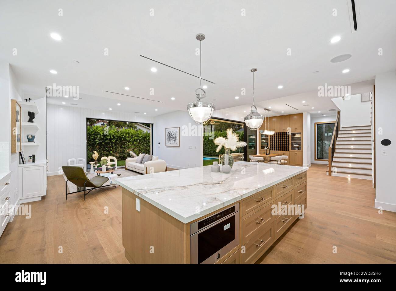 Modern kitchen with countertop seating and a sleek stovetop oven Stock ...