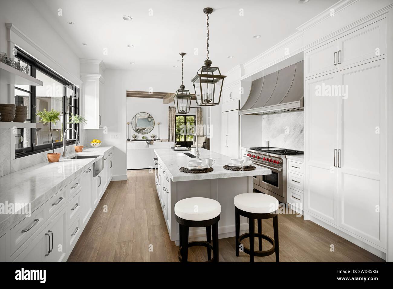 Clean modern kitchen with stainless steel appliances, white countertops ...