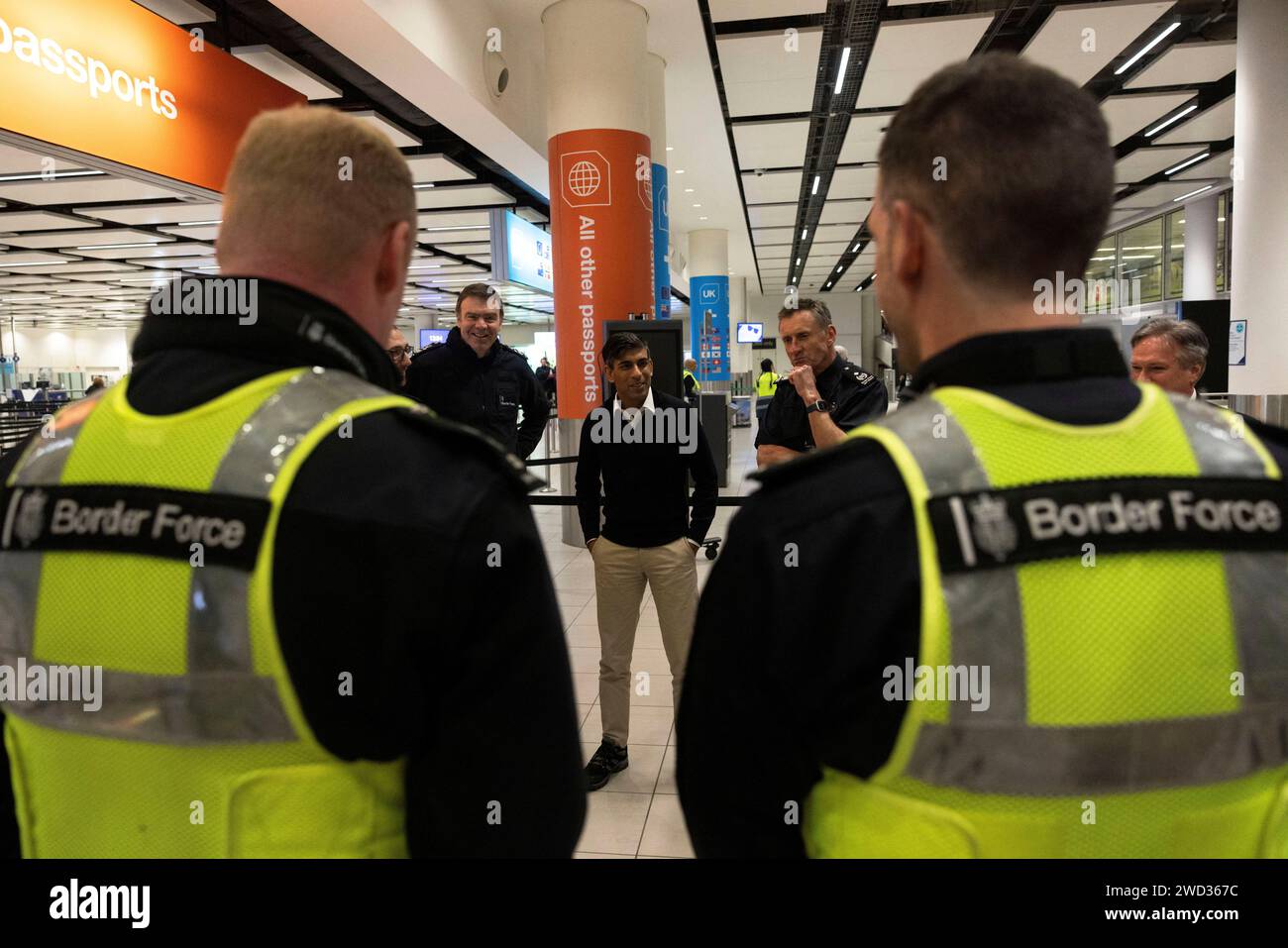 British Prime Minister Rishi Sunak, centre, meets with the Border Force ...