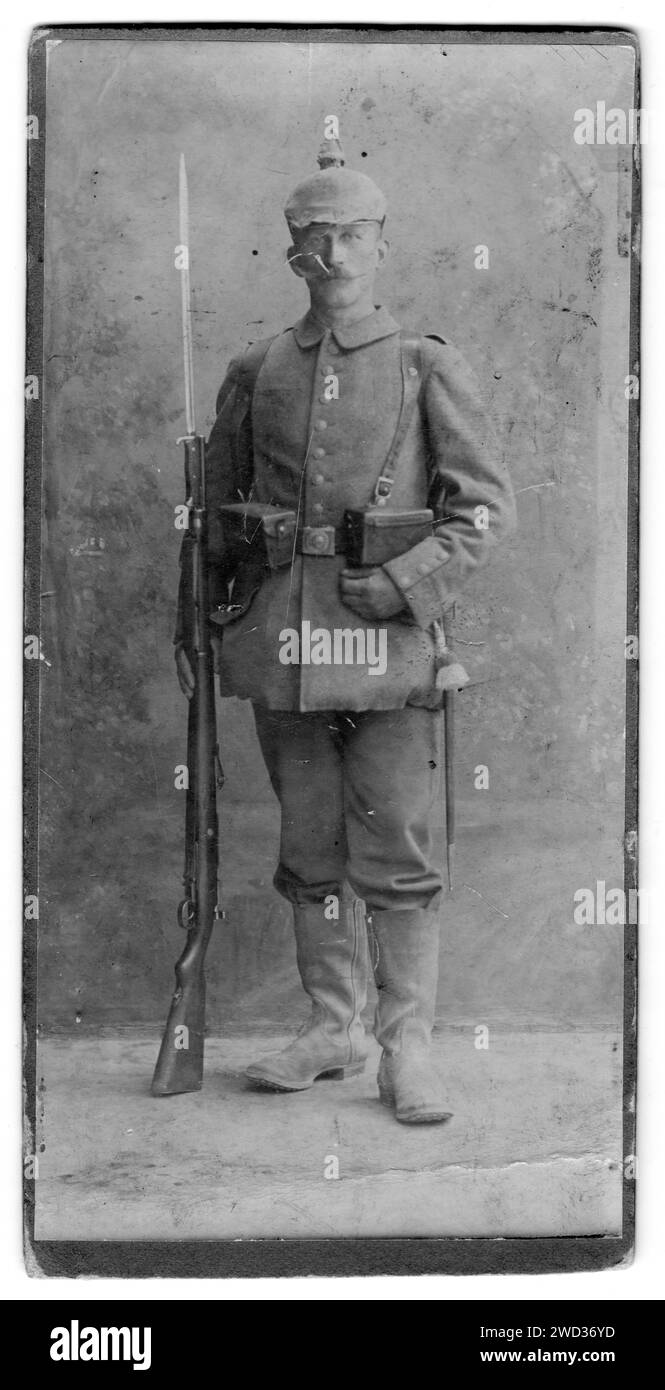 Studio full-length portrait of a German military man in a helmet and ...