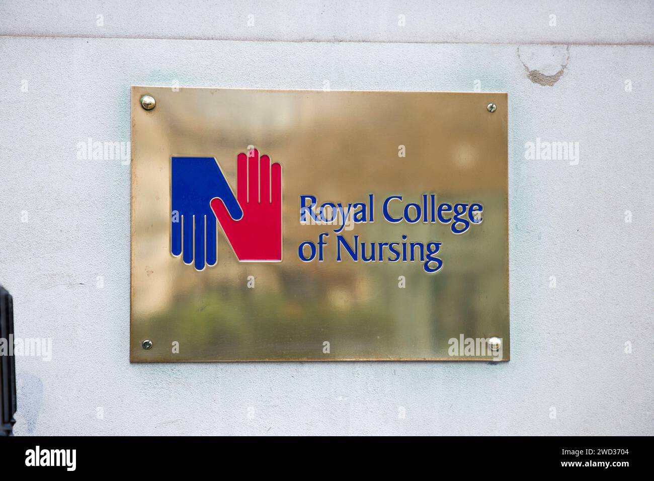Brass name plate / plaque outside the offices of / on office ...
