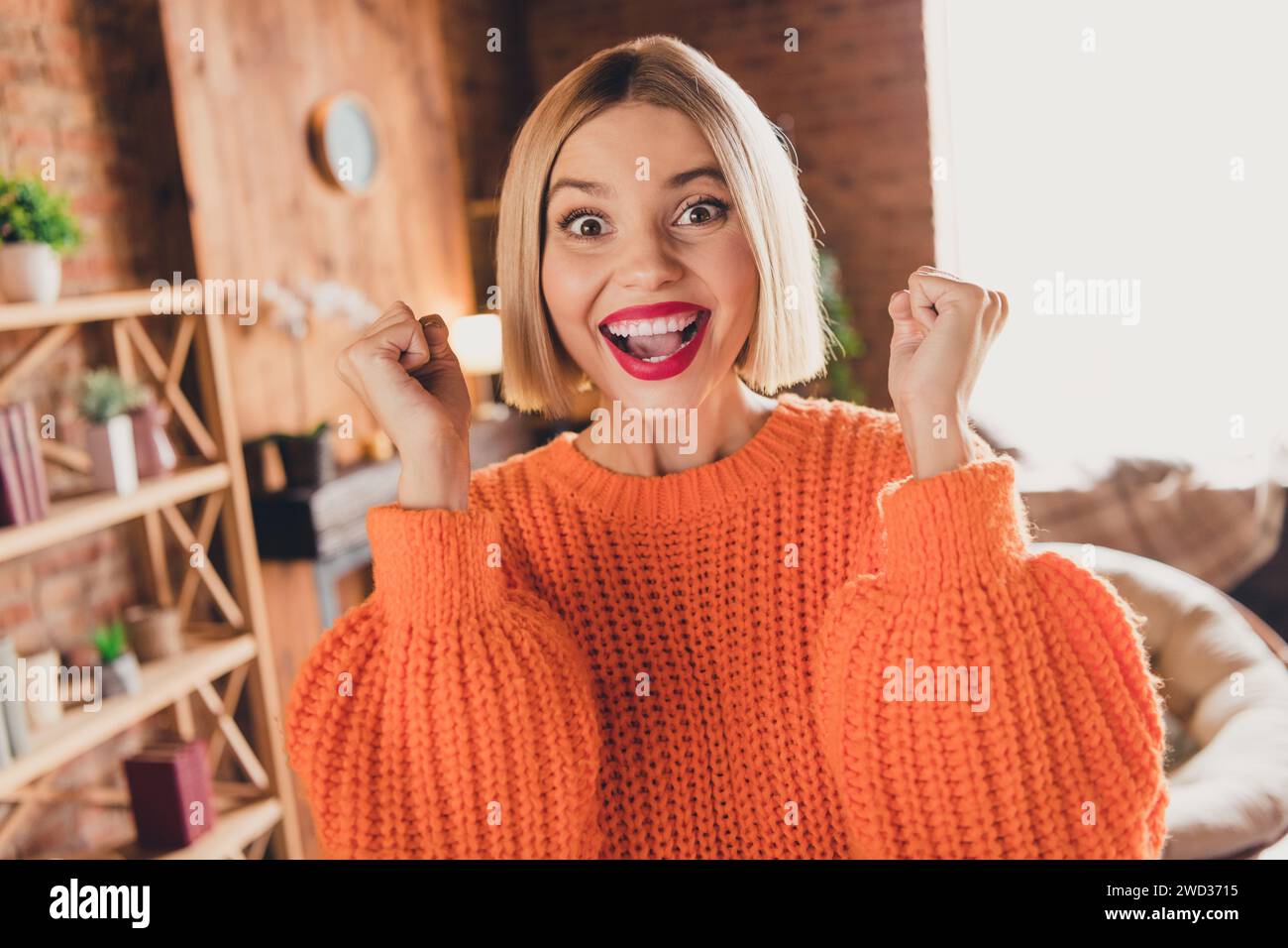 Photo of overjoyed nice cheerful person raise fists toothy smile shout ...