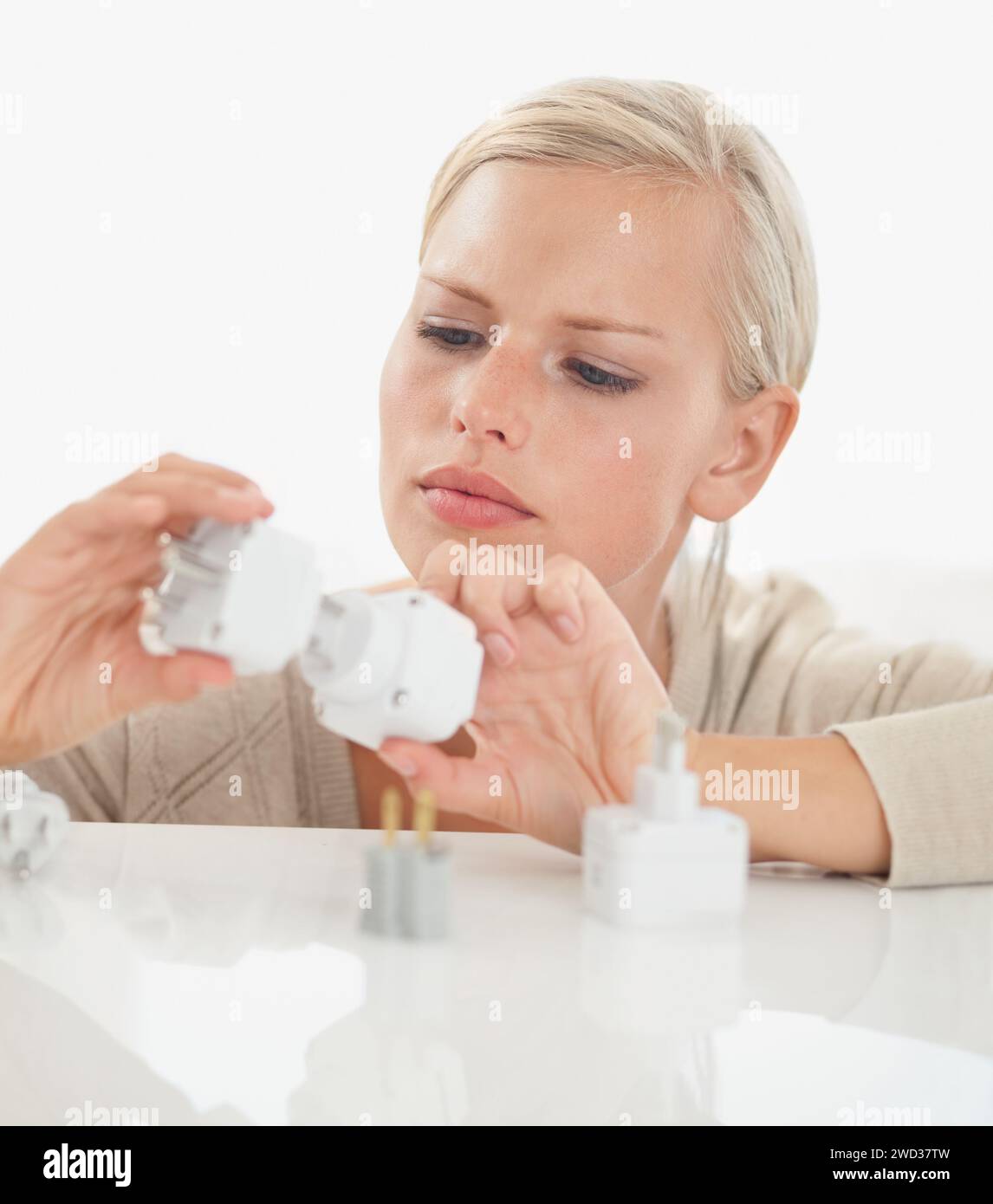Woman, power connection and plug at table, socket and outlet isolated ...