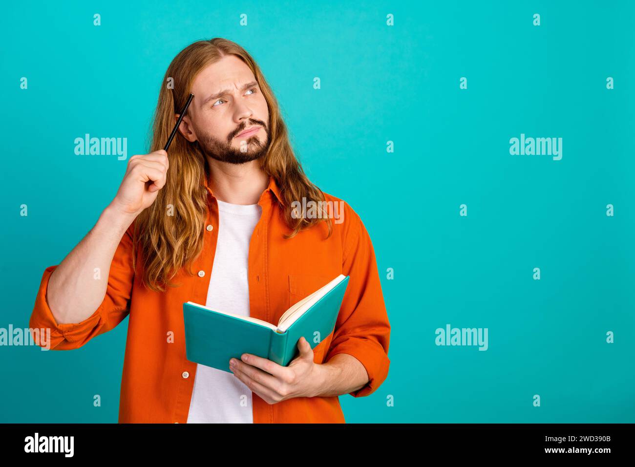 Portrait of intelligent writer with long hairstyle generate ideas for ...
