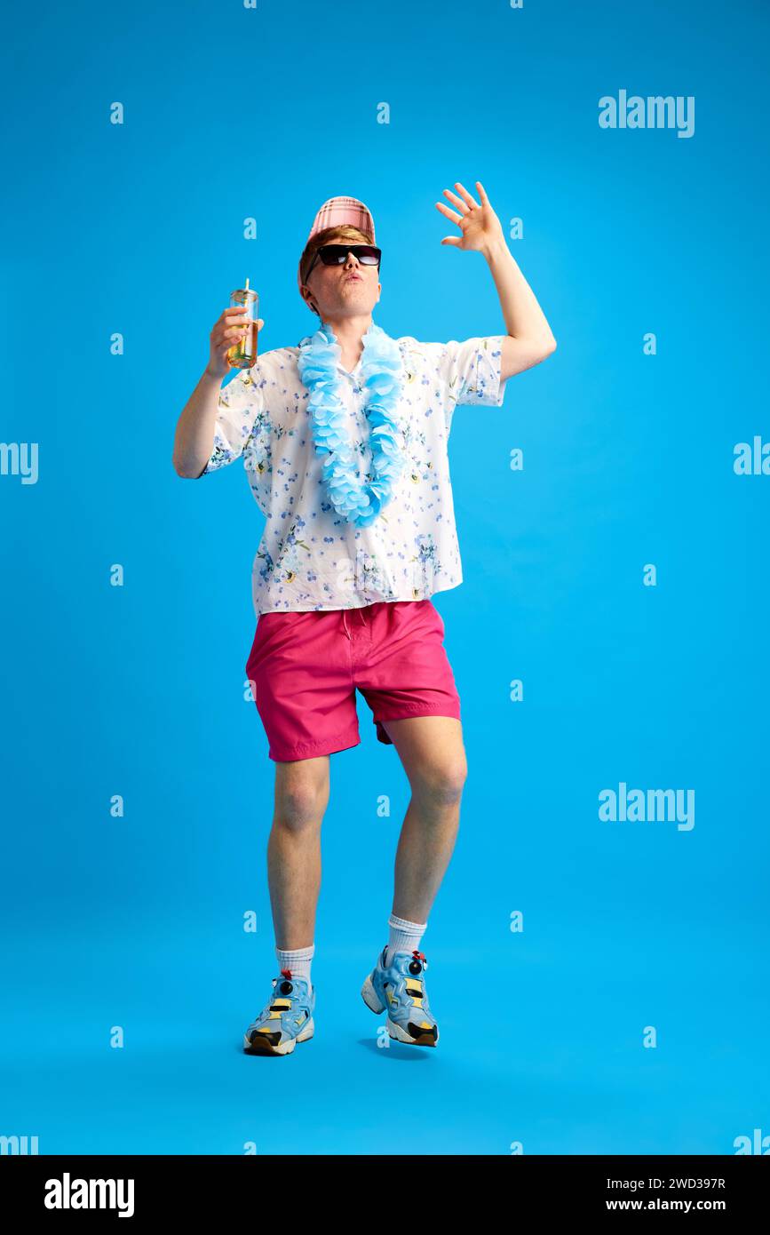 Young guy in casual stylish clothes, shrift and shorts, in sunglasses ...