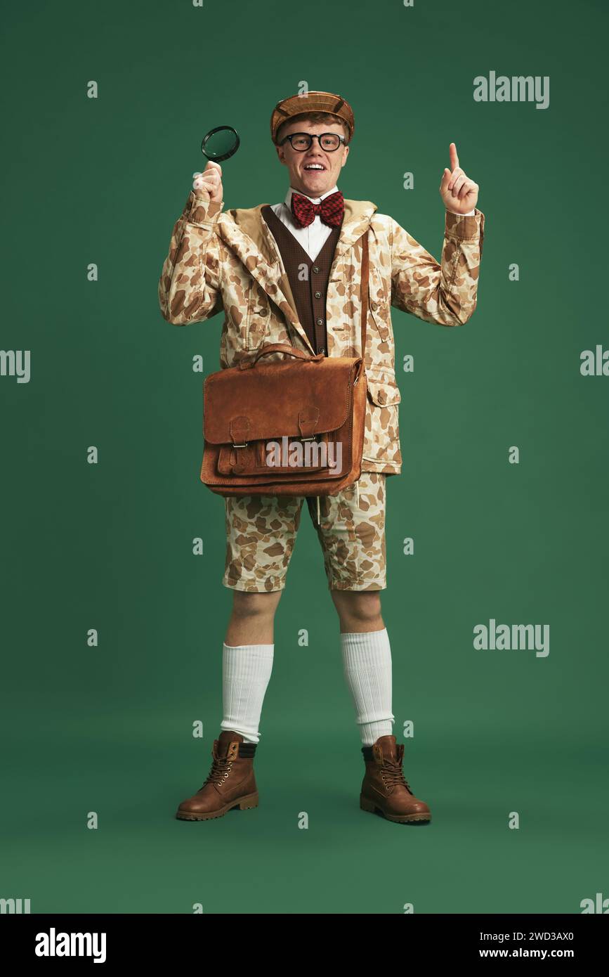 Full-length image of young guy wearing retro clothes of detective ...