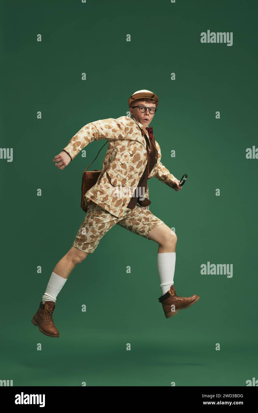 Young guy in age of detective running away with emotive face against ...