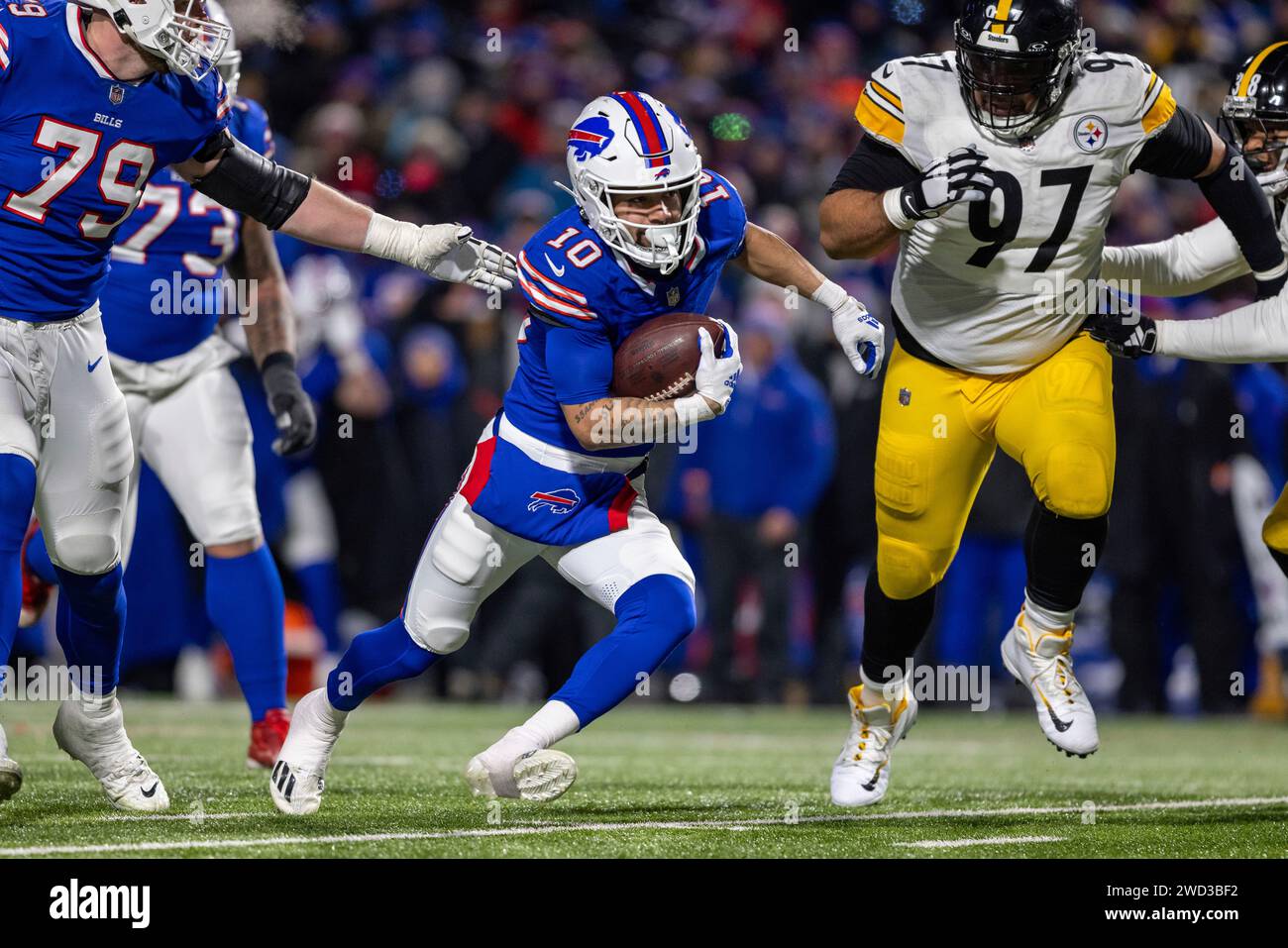 Buffalo Bills quarterback Josh Allen (17) runs after a catch for a 17 ...