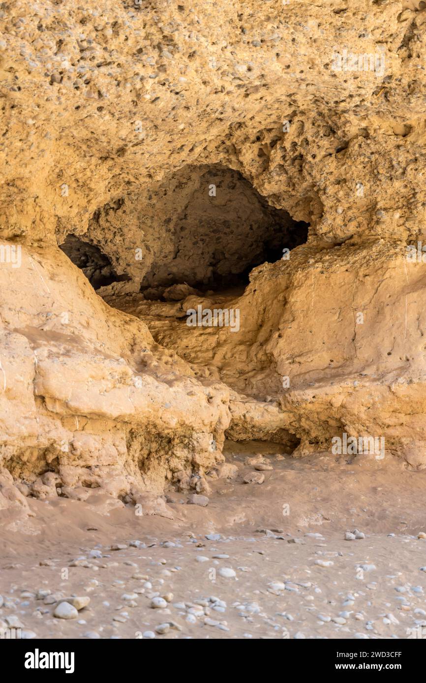landscape with cavern hole in sandstone cliffs at narrow Serisem canyon ...
