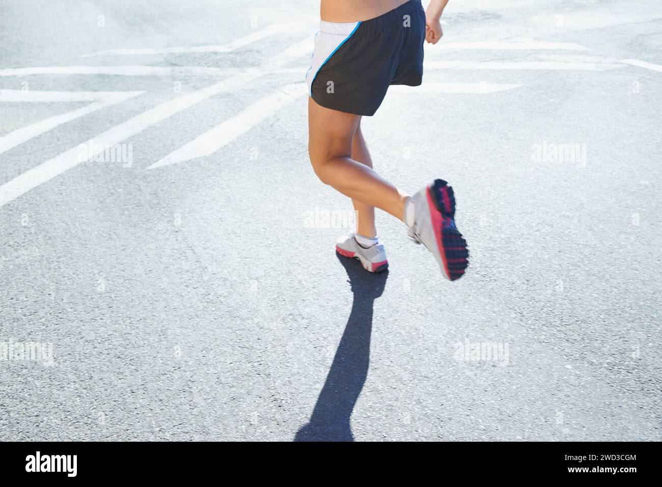 Closeup, running and legs with woman, fitness and exercise with ...