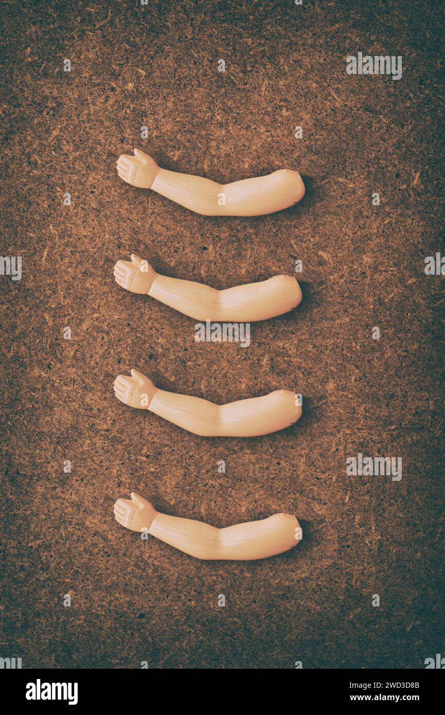 row of four plastic doll arms Stock Photo - Alamy