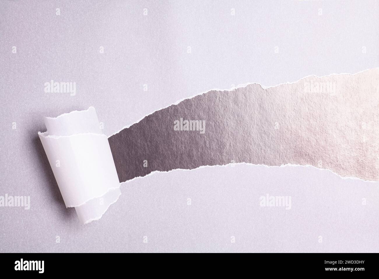 Torn paper with opening showing black background Stock Photo - Alamy