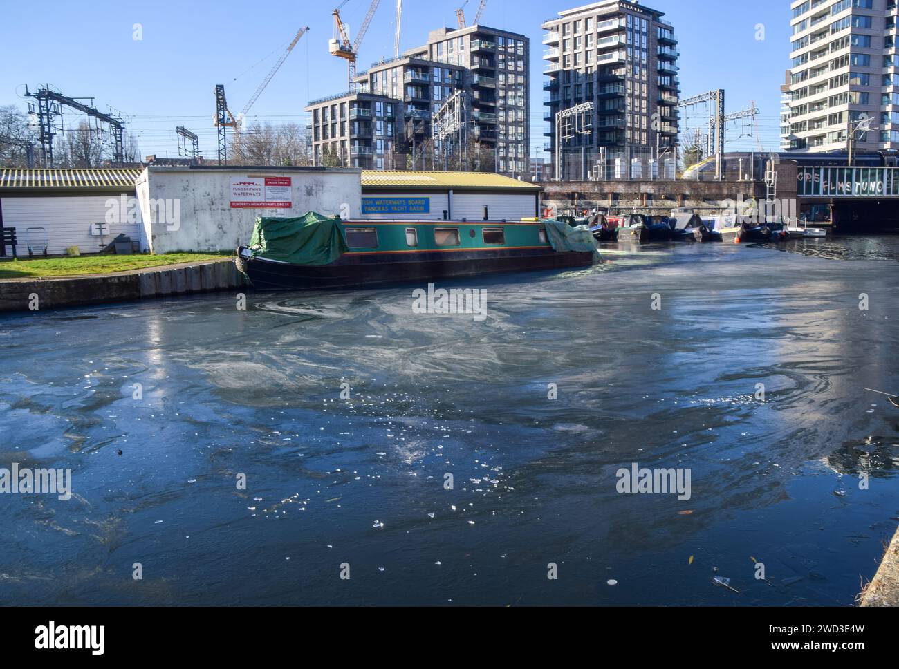 London, UK. 18th January 2024. Partially frozen Regent's Canal in King ...