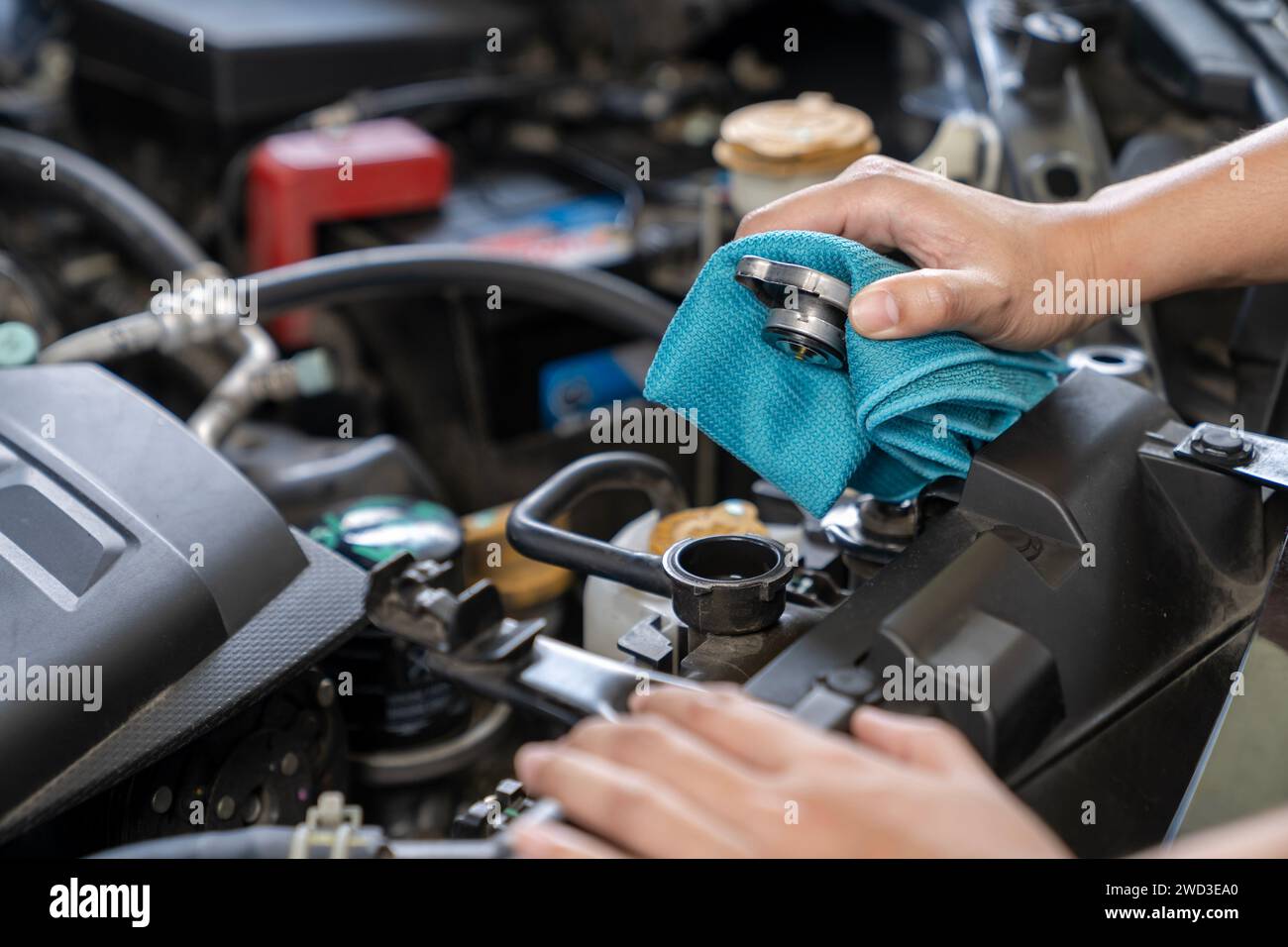 A woman is opening radiator cap Stock Photo - Alamy