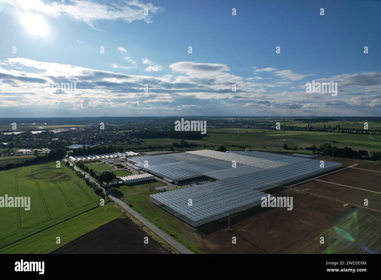 Glass greenhouses from above in sunny weather, big glass houses from ...
